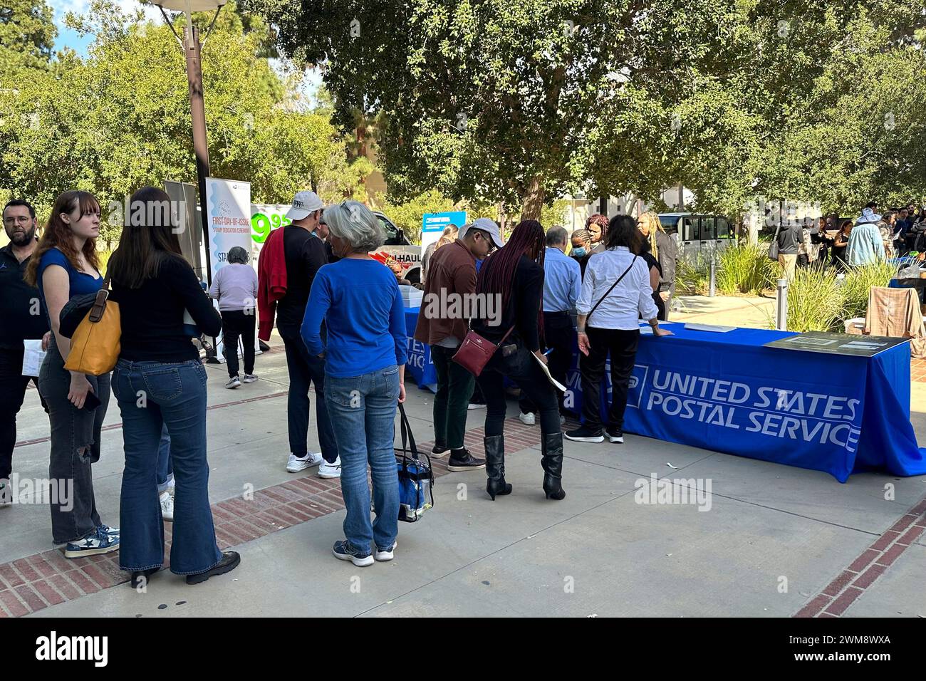 People line up to buy the new John Wooden forever stamp on its first ...