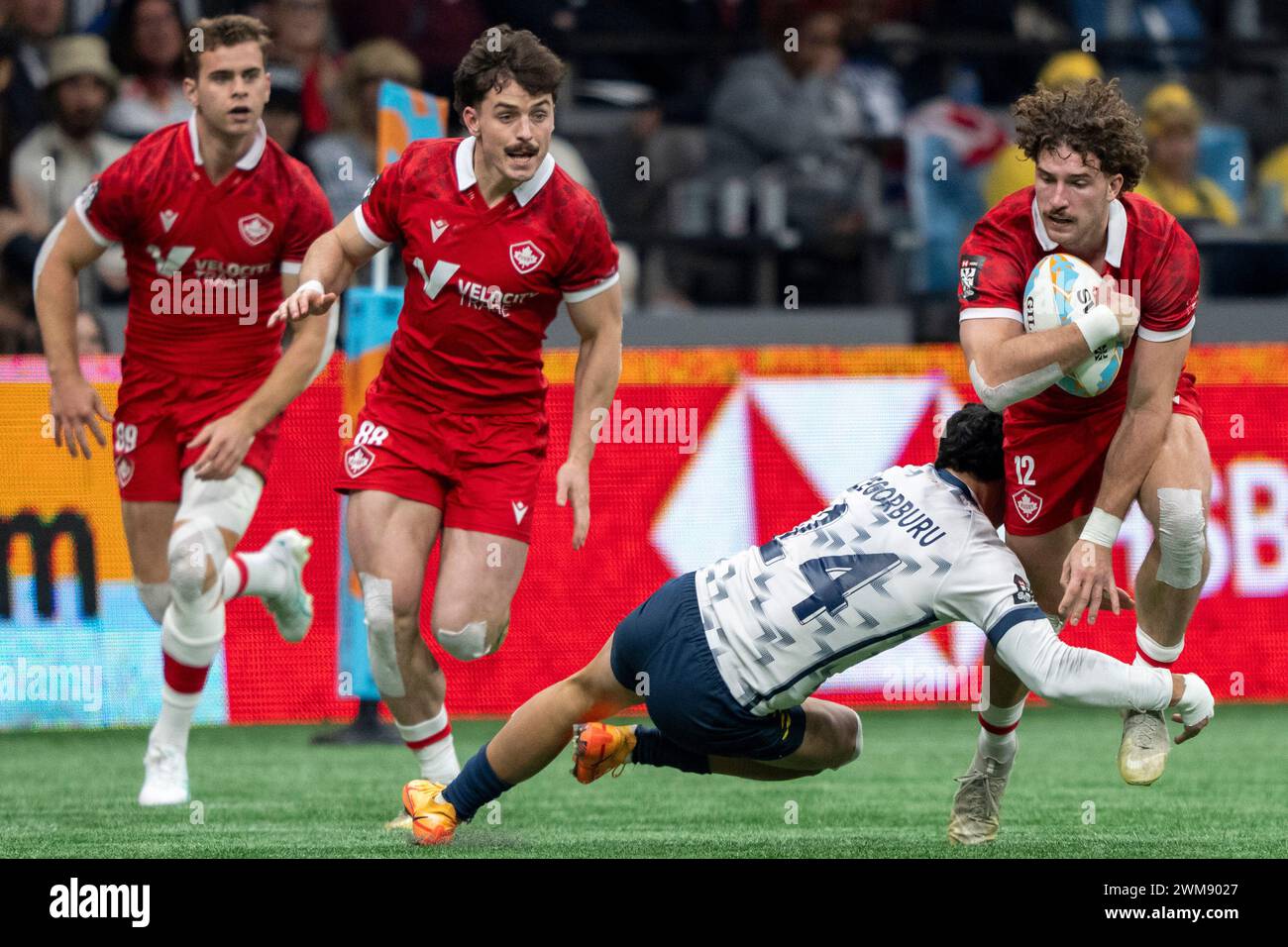 Canada's David Richard, right, is hit by Spain's Anton Legorburu as ...