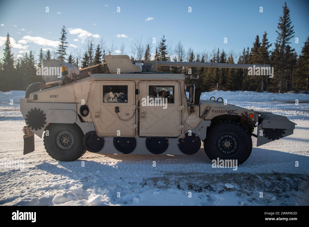 A high mobility multipurpose wheeled vehicle (HMMWV) is visually ...