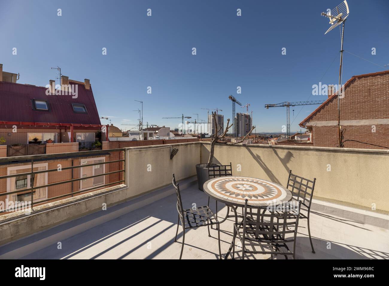 Rooftop of a building overlooking buildings under construction with a ...