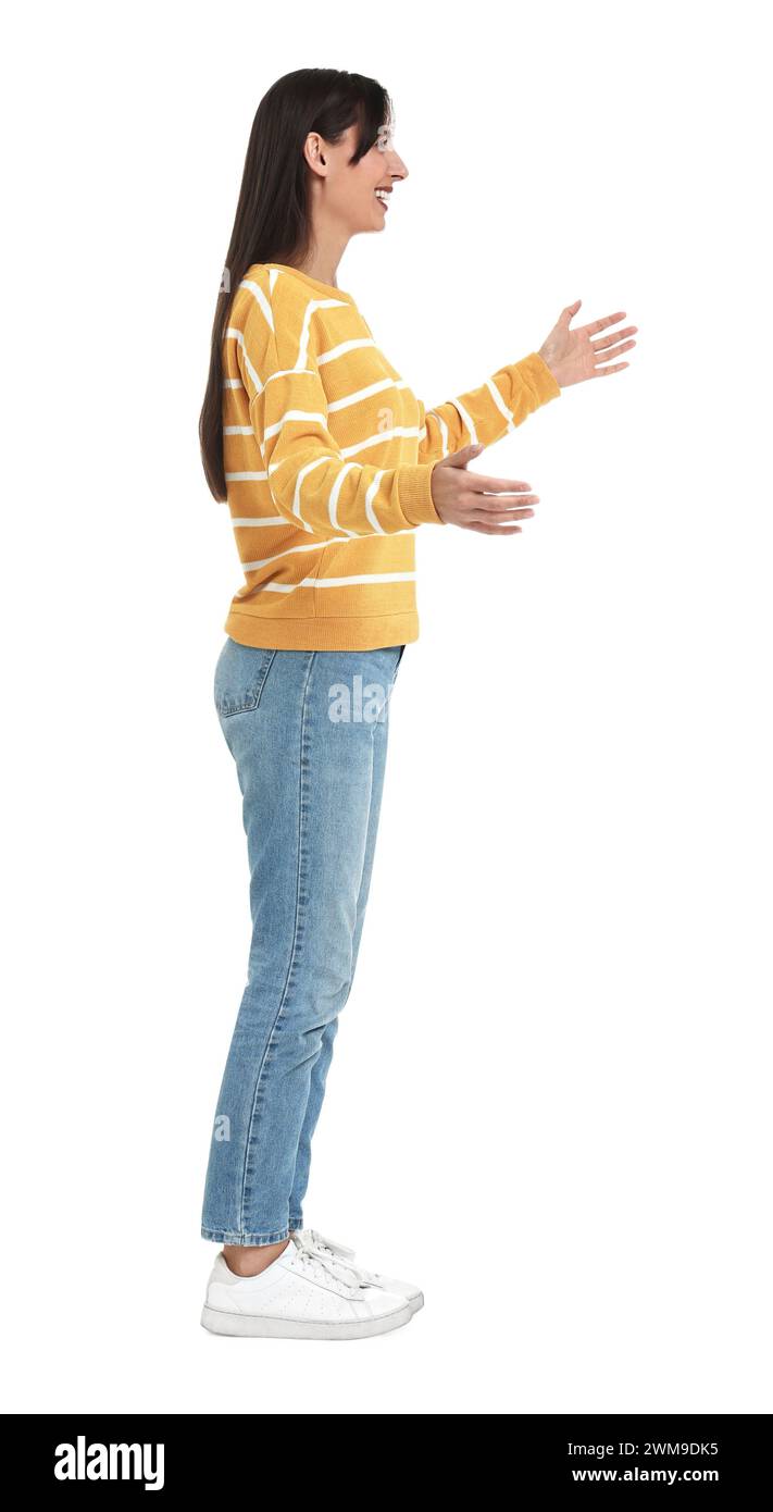 Happy woman greeting someone on white background Stock Photo - Alamy