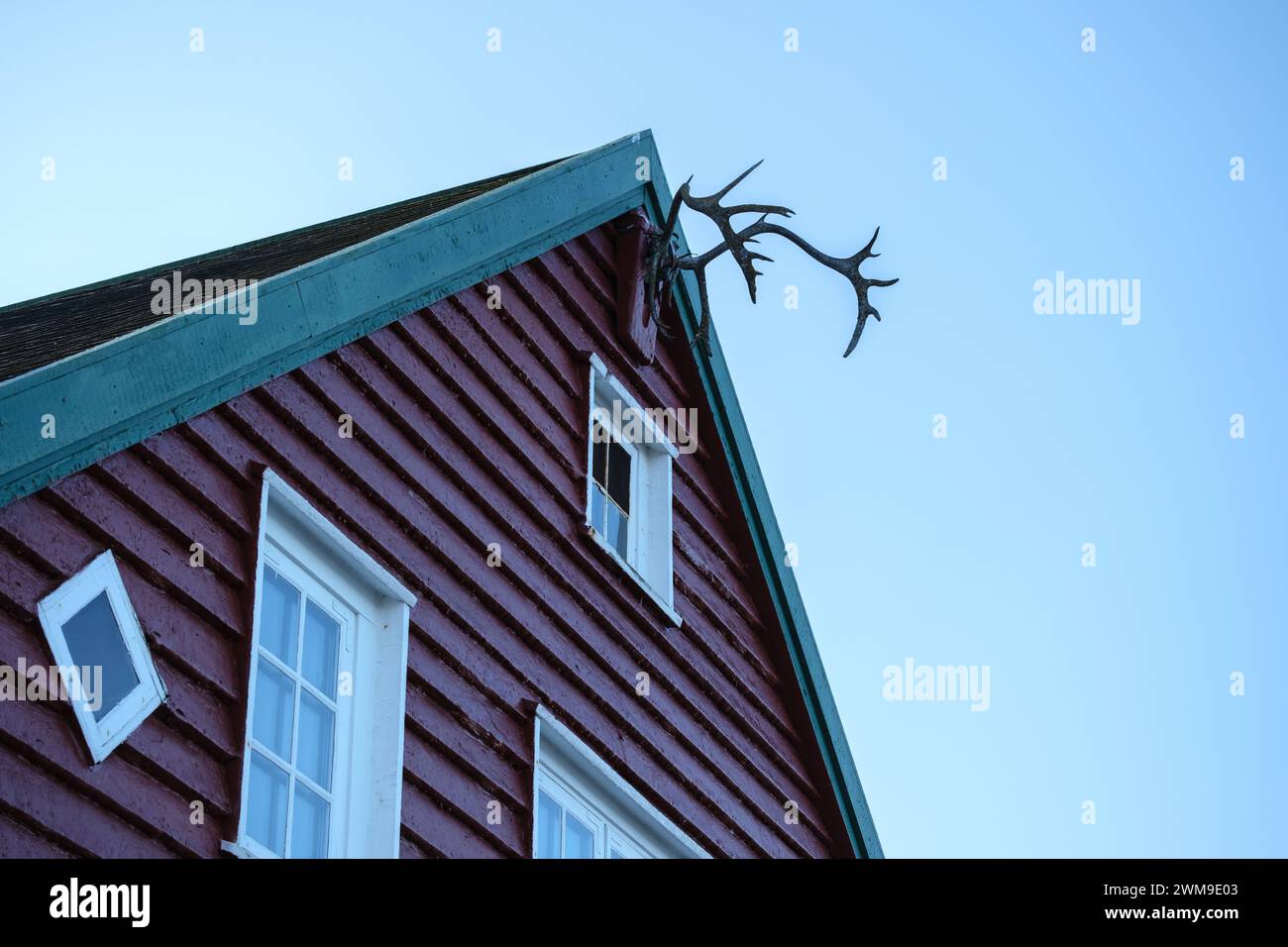 Looking up the side of a red building that is part of the Nuutoqaq ...