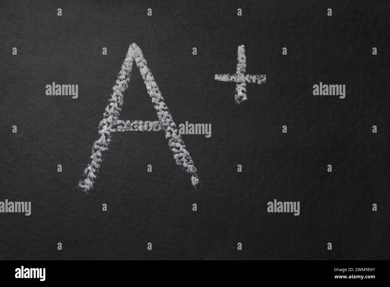 School grade. Letter A with plus symbol on blackboard, top view. Space ...