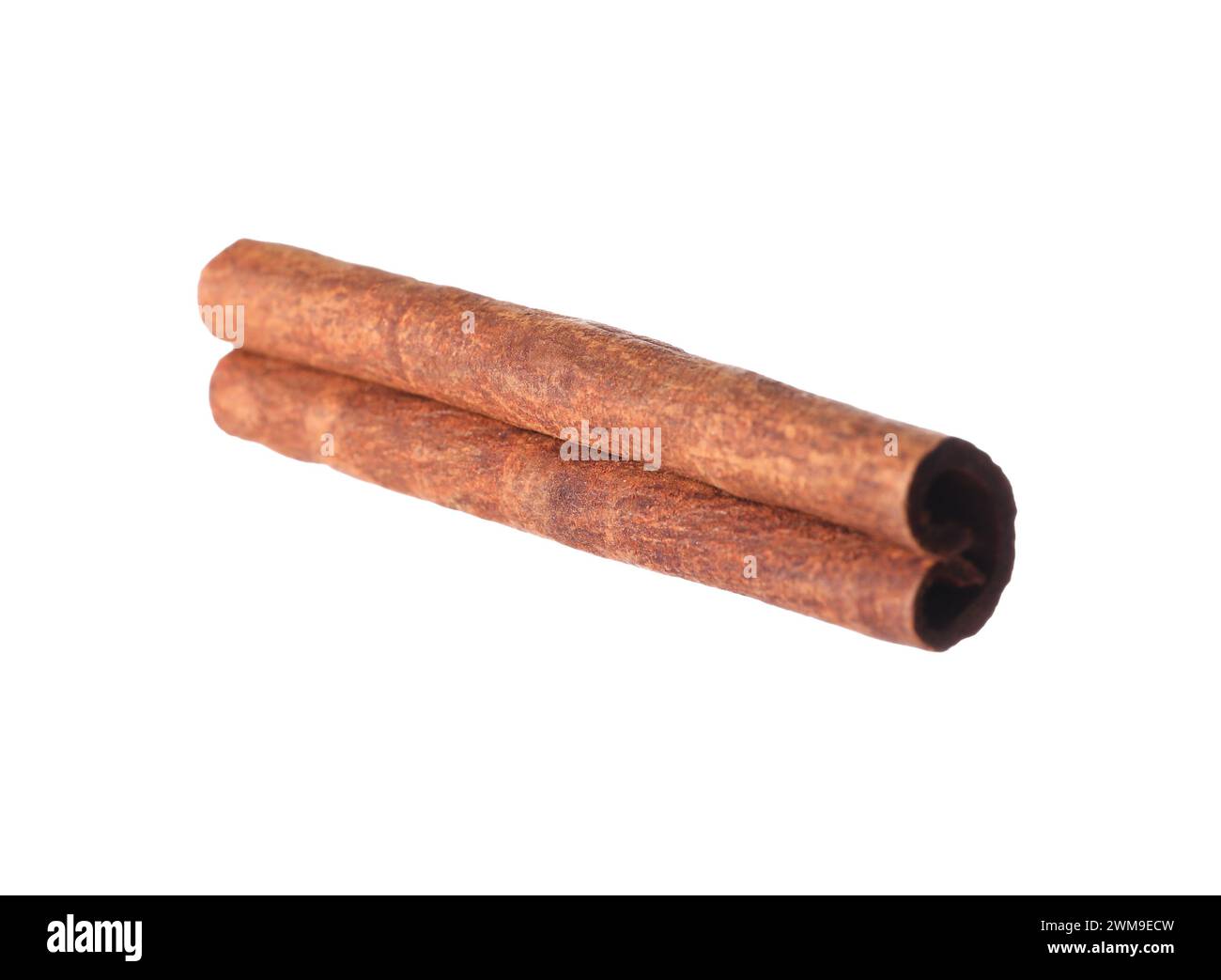 One aromatic cinnamon stick isolated on white Stock Photo - Alamy