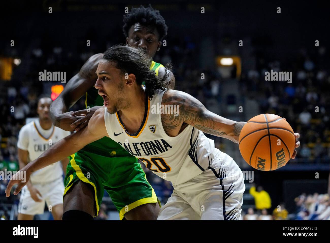 California guard Jaylon Tyson (20) moves the ball while defended by ...