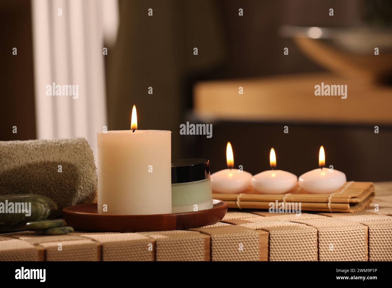 Beautiful composition with different spa products on wicker bench ...