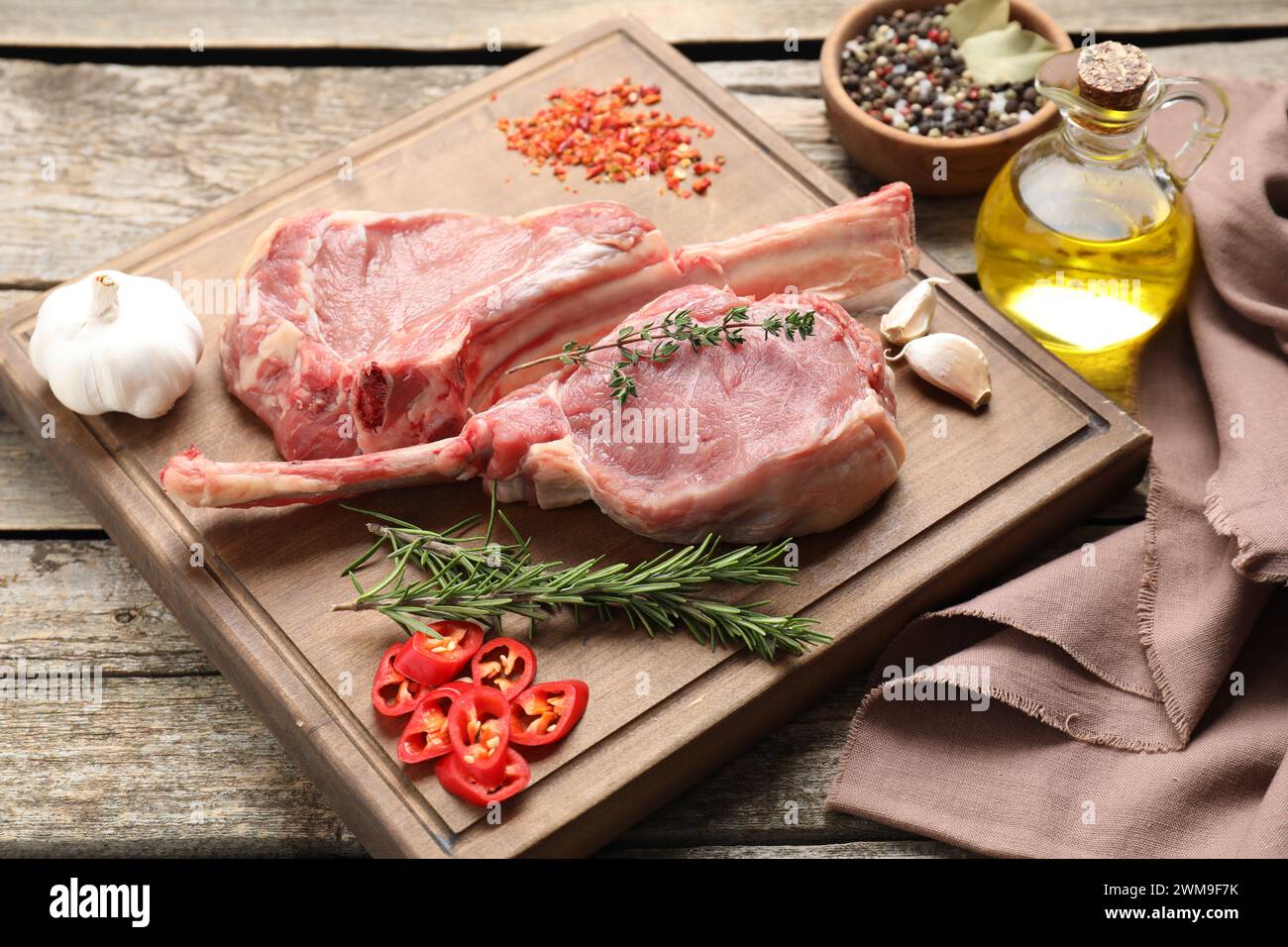 Fresh tomahawk beef cuts and spices on wooden table Stock Photo - Alamy