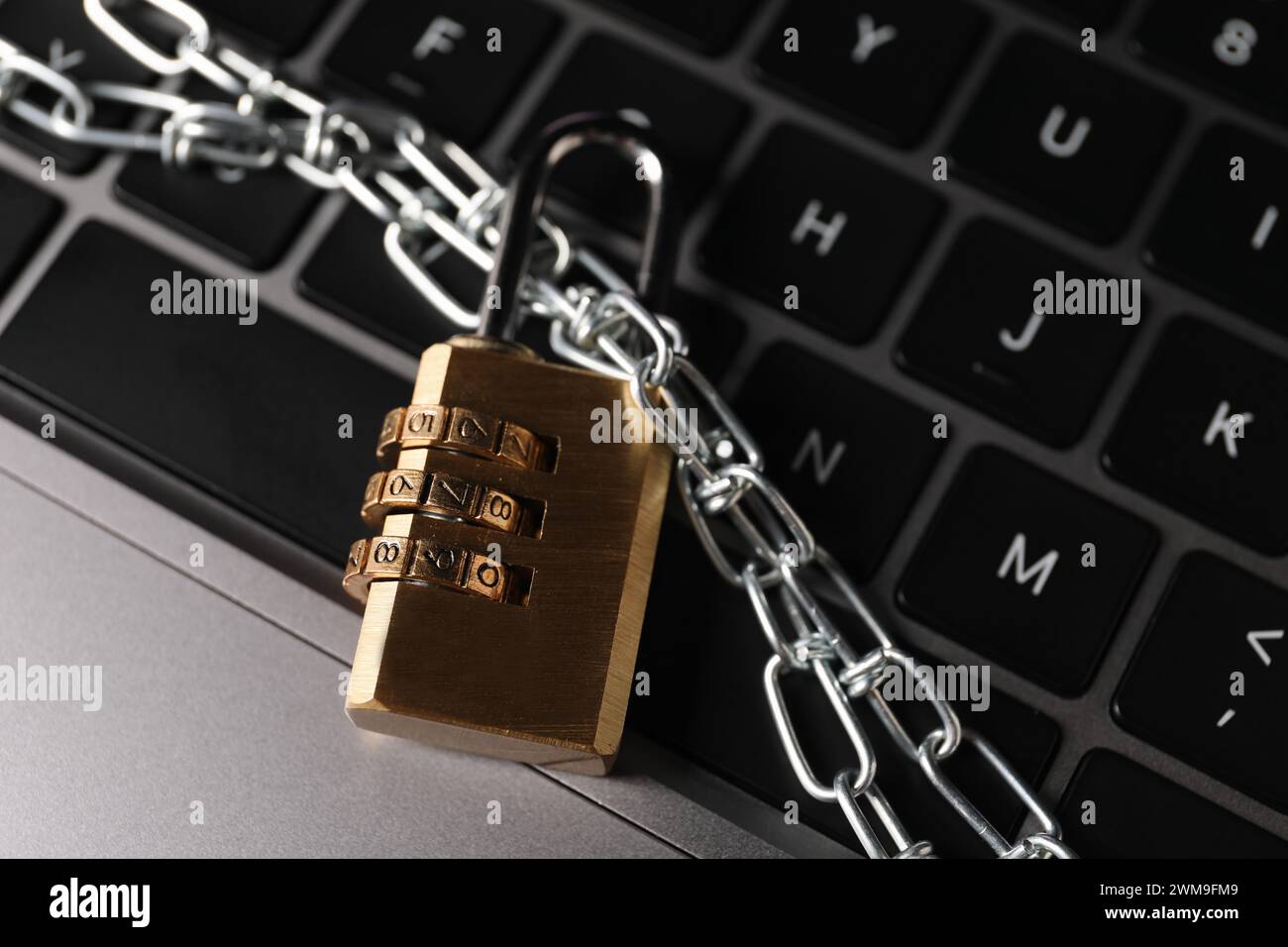 Cyber security. Padlock with chain on laptop, closeup Stock Photo - Alamy