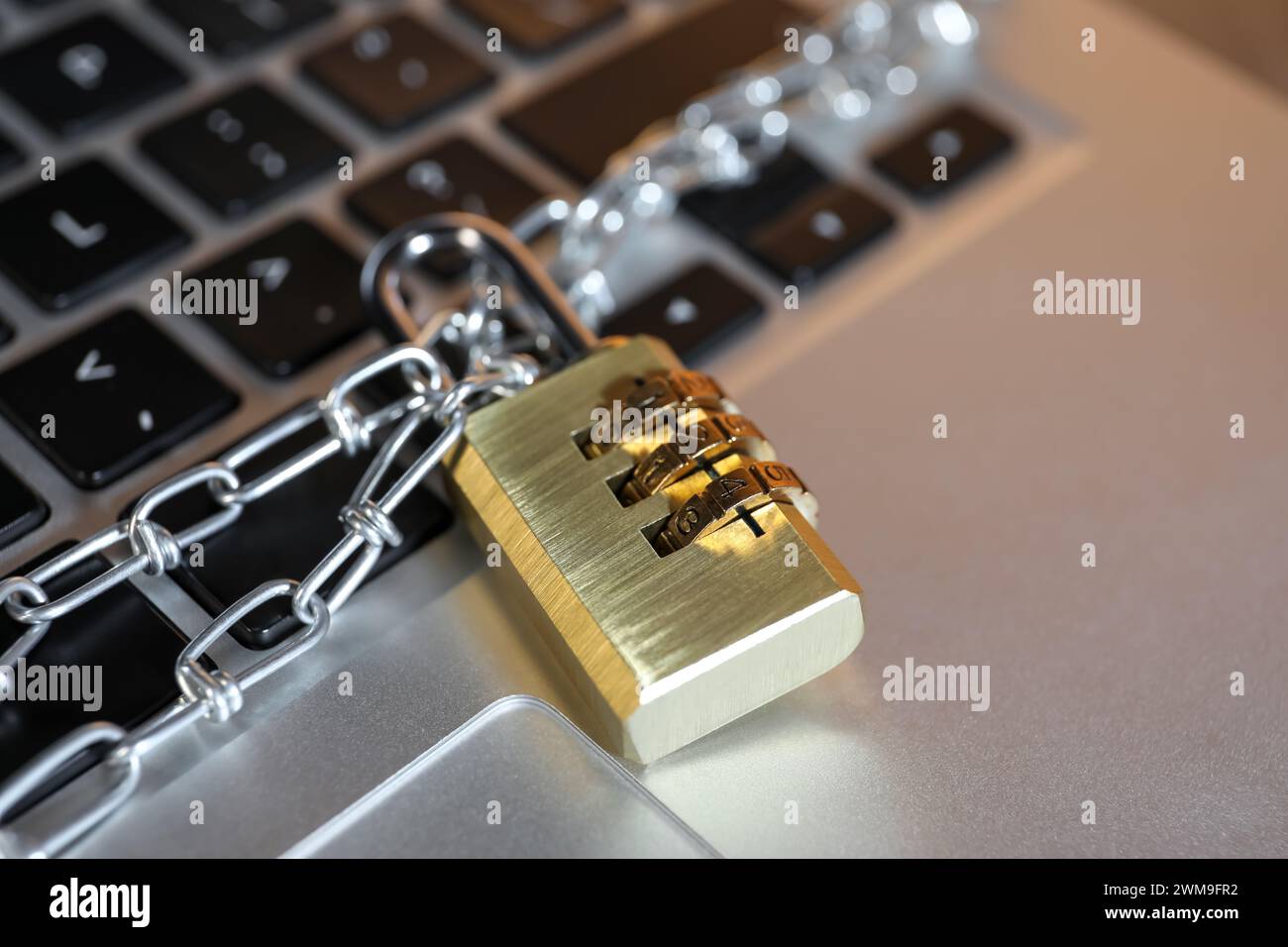 Cyber security. Padlock with chain on laptop, closeup Stock Photo - Alamy