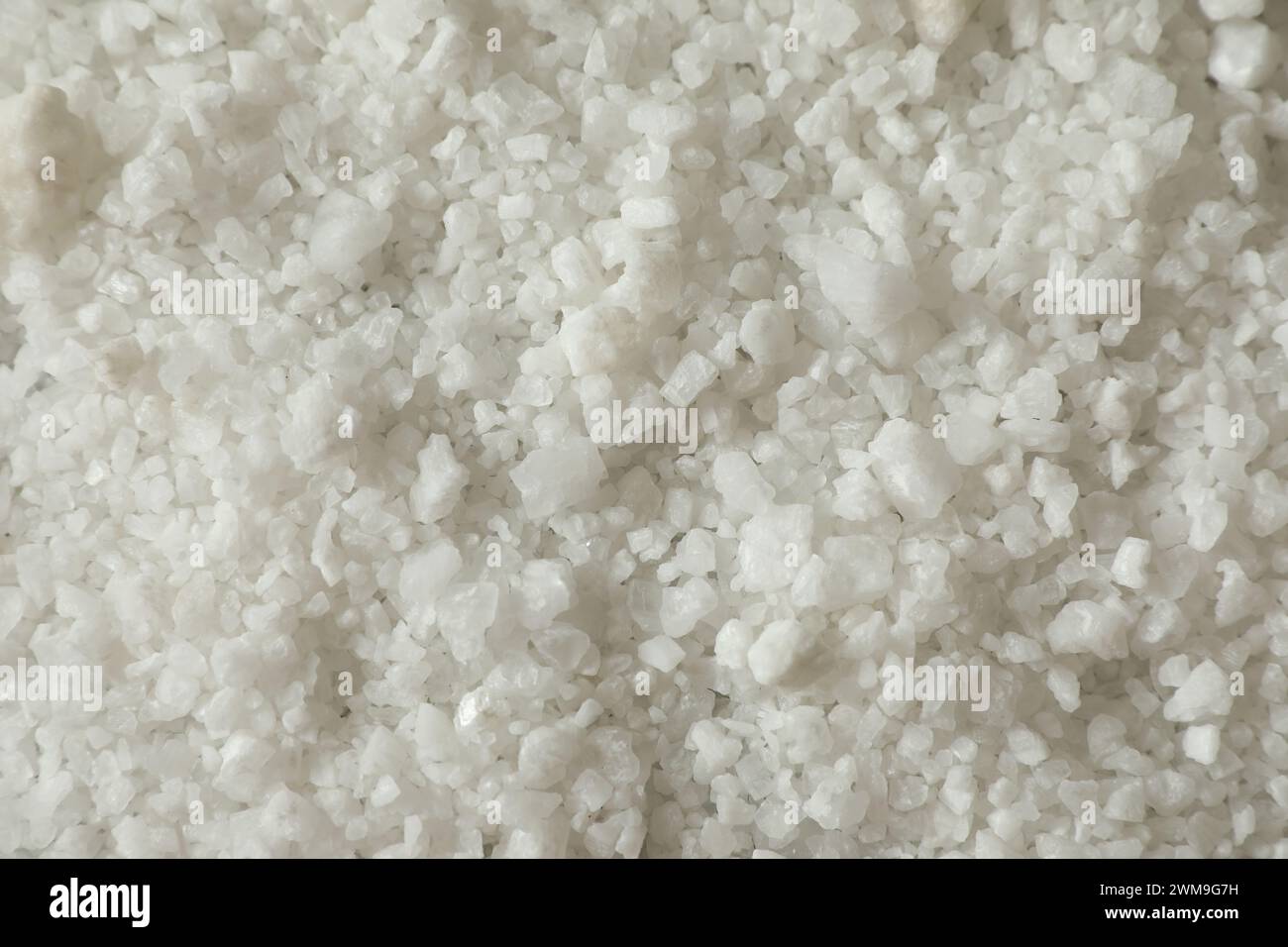 Organic sea salt as background, top view Stock Photo - Alamy