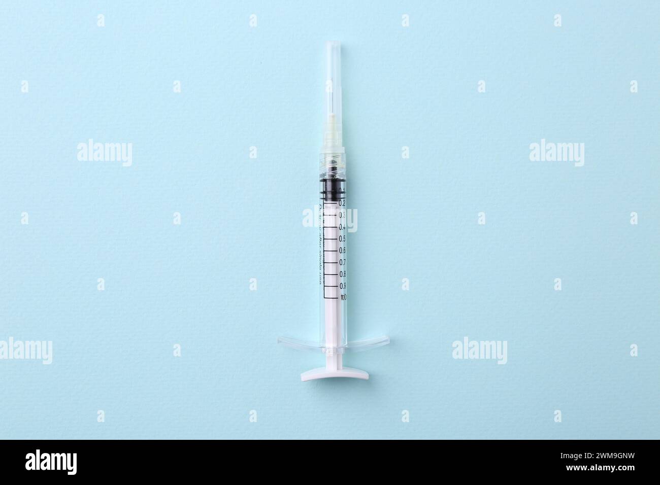 Cosmetology. Medical syringe on light blue background, top view Stock ...