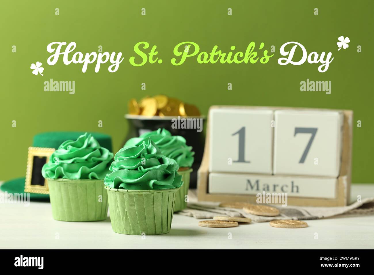 Happy St. Patrick's day card. Cupcakes, pot of gold and wooden block ...
