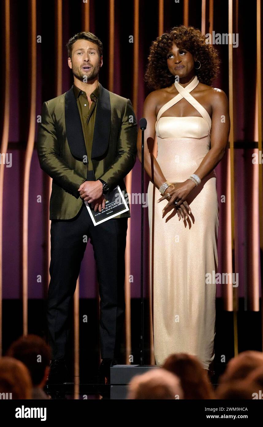 Glen Powell, left, and Issa Rae present the award for outstanding ...