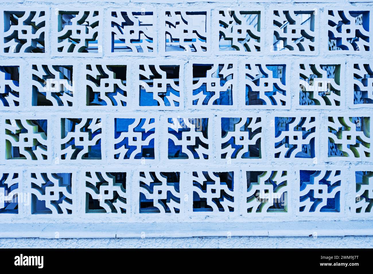 A light blue brick wall with symmetrical patterns Stock Photo - Alamy