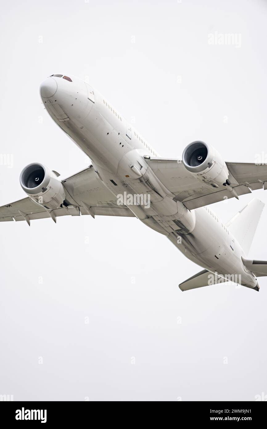 Fuselage of a completely white passenger plane with two jet engines ...