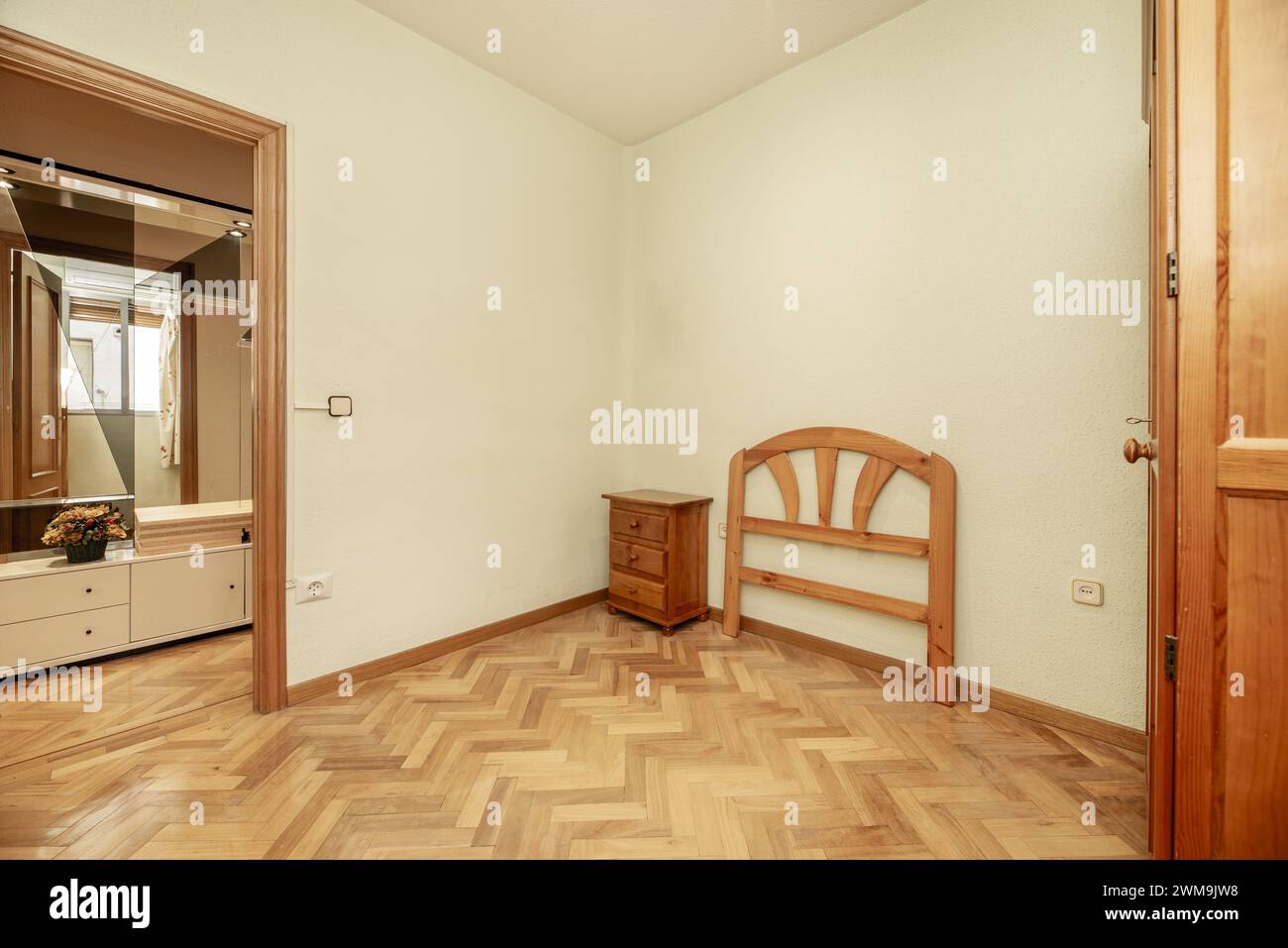Empty room with some wooden furniture, glossy varnished parquet floor ... Empty room with some wooden furniture, glossy varnished parquet floor ...