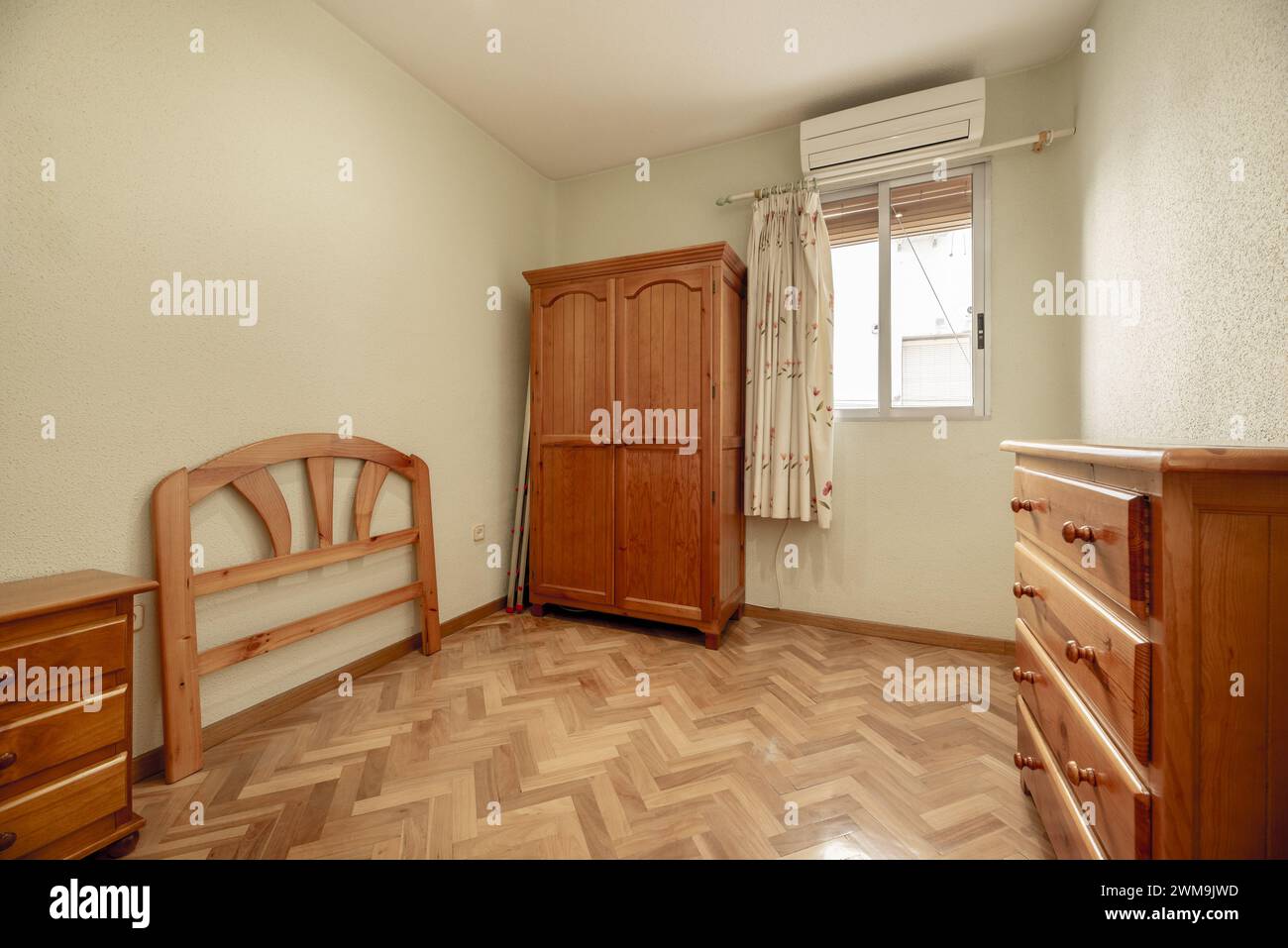 Half empty room with some varnished sweet pine wood furniture, shiny ...