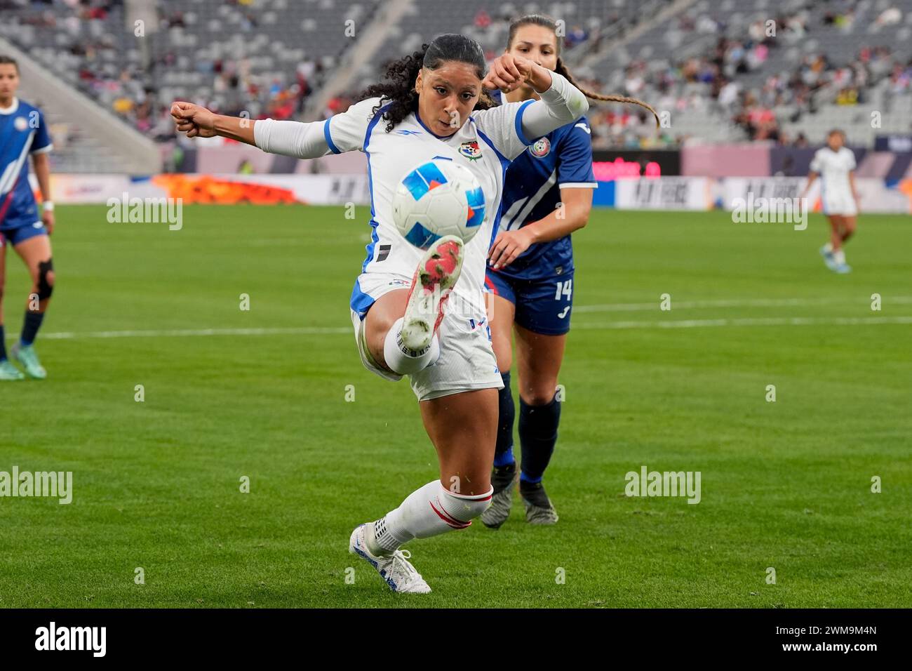 Panama's Katherin Parris, center, controls the ball as Puerto Rico's ...