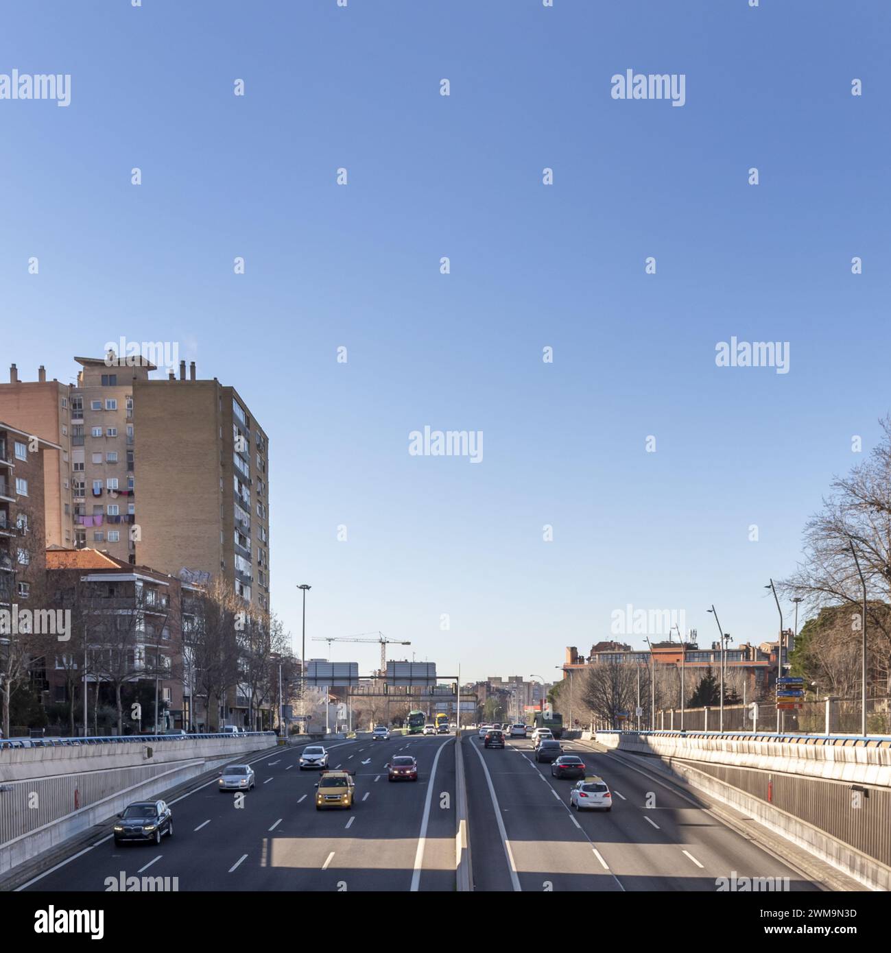 Access road to the city center with many lanes in both directions and ...