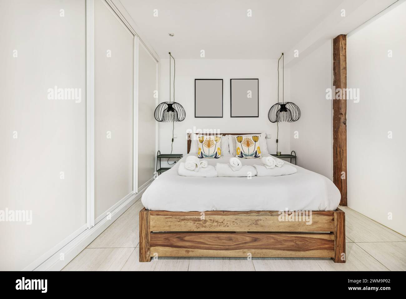 Bedroom with double bed with peculiar wooden structure, current ...