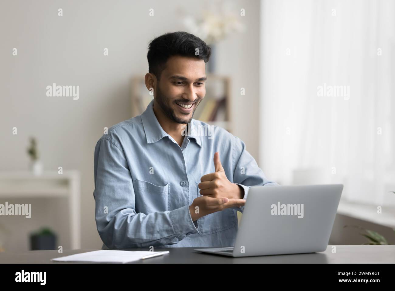 Indian man with hearing disability makes videocall using sign language ...