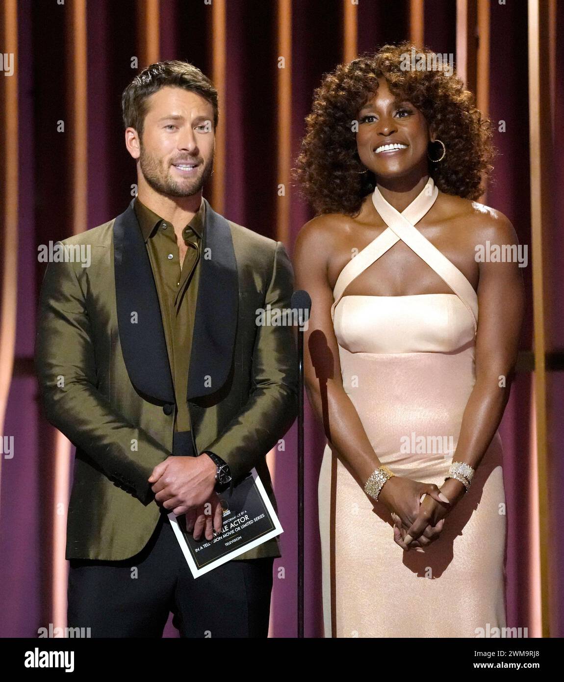 Glen Powell, left, and Issa Rae present the award for outstanding ...