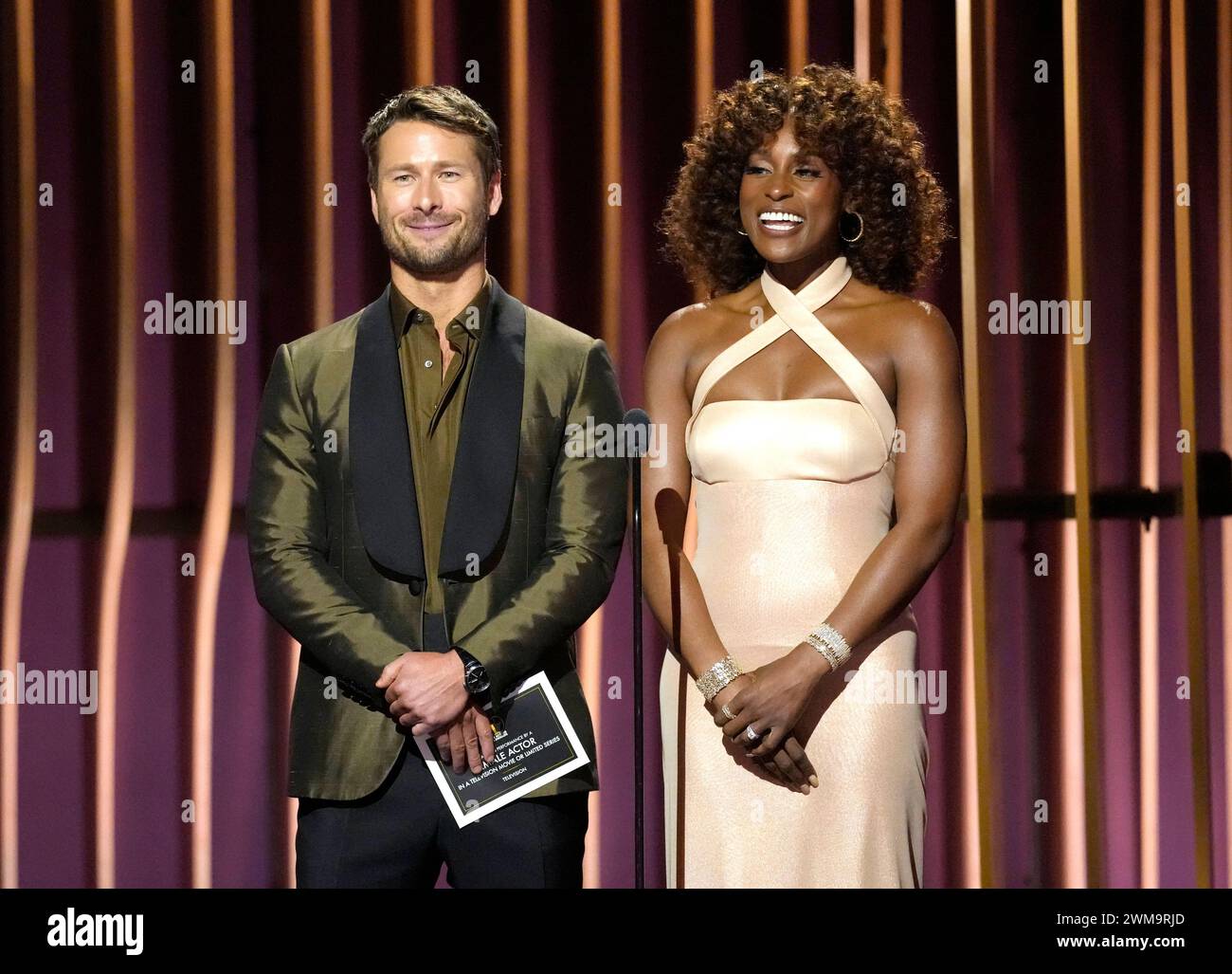 Glen Powell, left, and Issa Rae present the award for outstanding ...