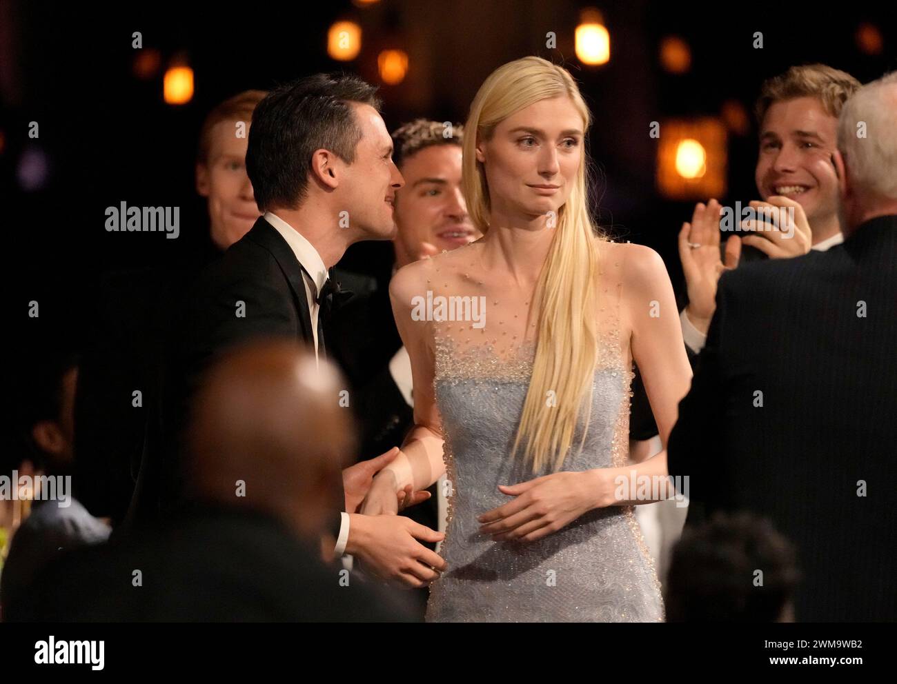 Kristian Rasmussen, left, embraces Elizabeth Debicki as she wins the ...