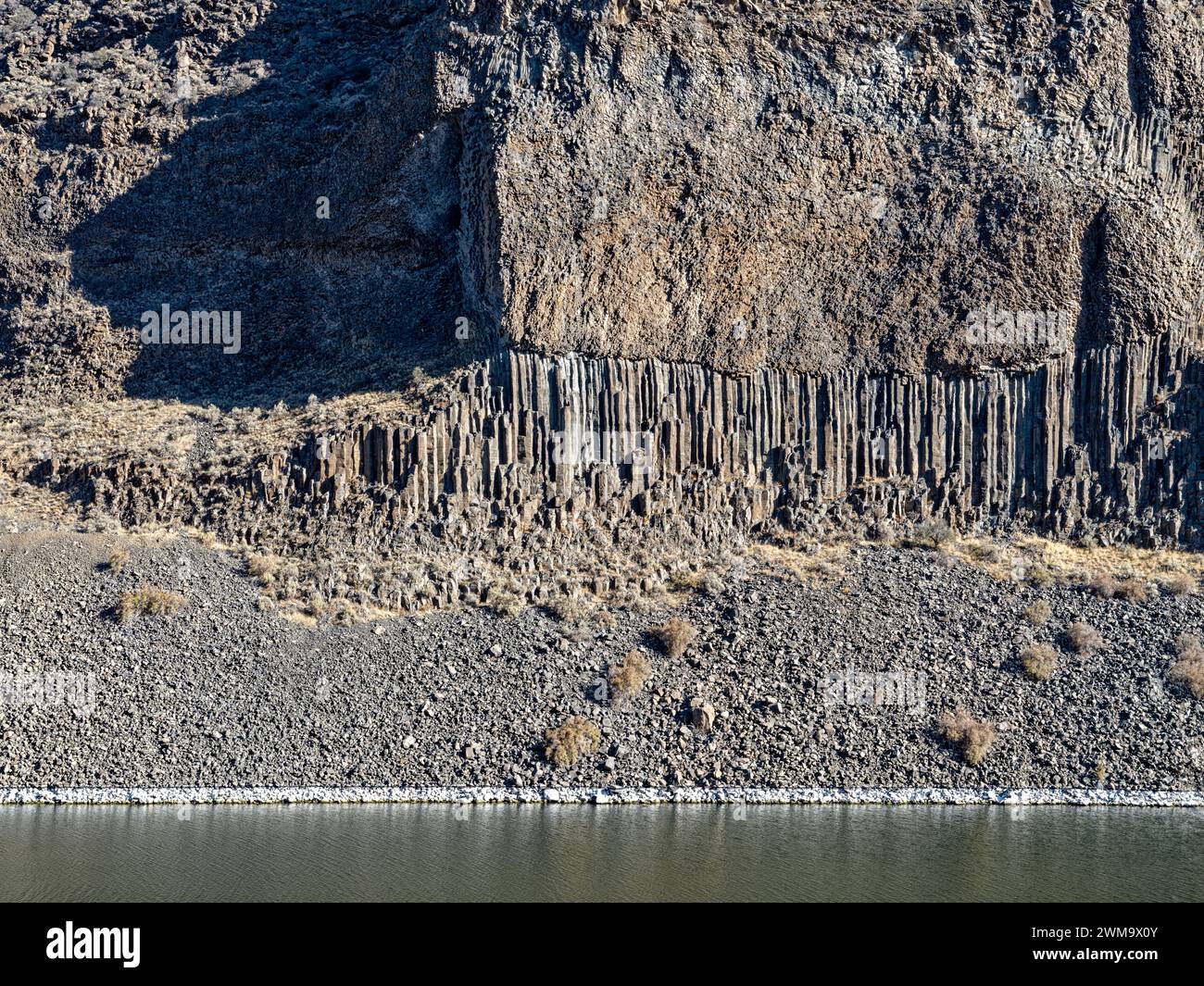 Basalt cliffs rising above the Deschutes River show ancient volcanic ...