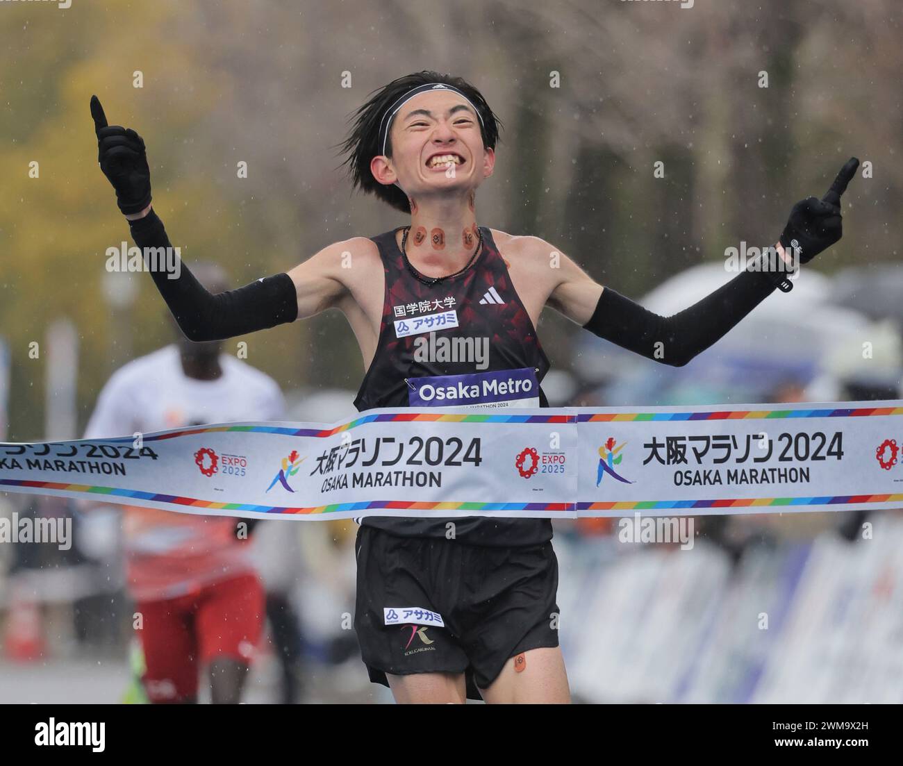 Kiyoto Hirabayashi of Japan crosses the finish line during Osaka ...