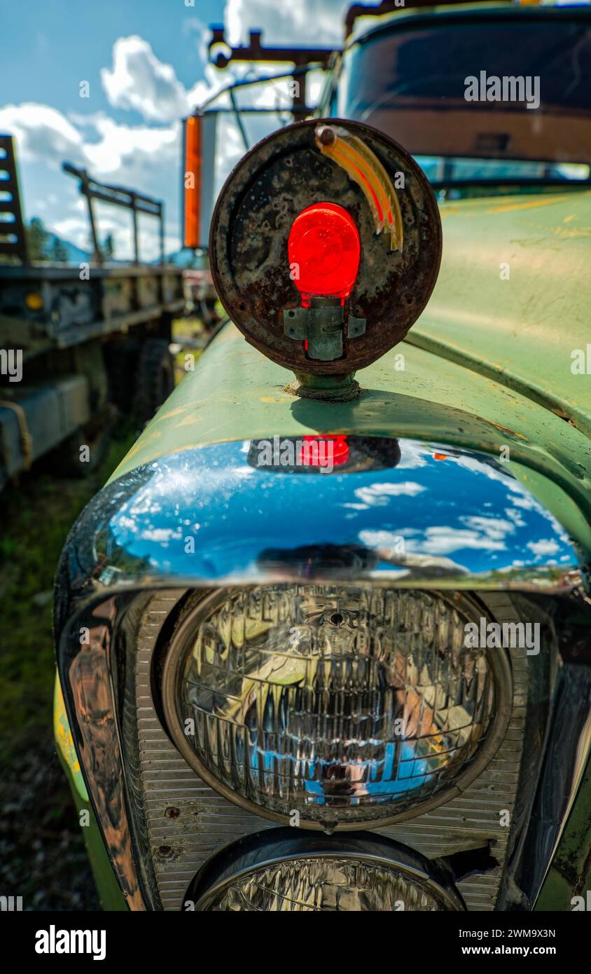 Broken turn signal lamp and headlights on an abandoned truck in a ...