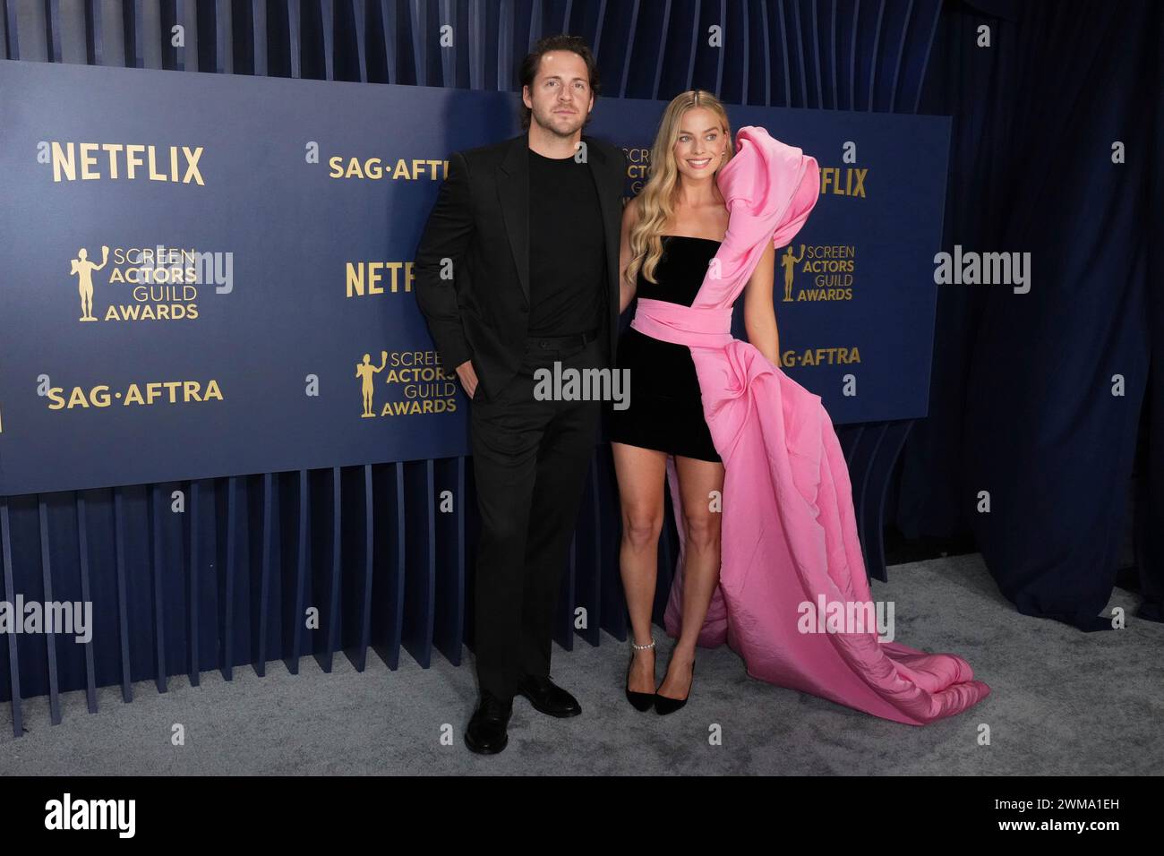 Tom Ackerley, left, and Margot Robbie arrive at the 30th annual Screen ...