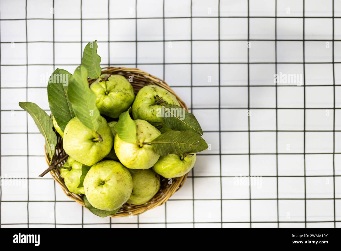 Top view a fresh green raw guava. Fruit with bright green bark and ...