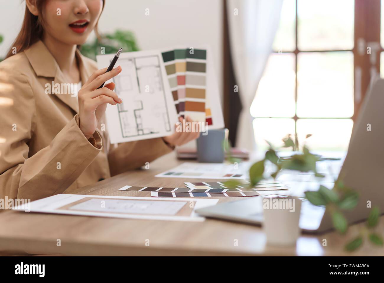 Architecture concept, Female architect presenting house interior design ...