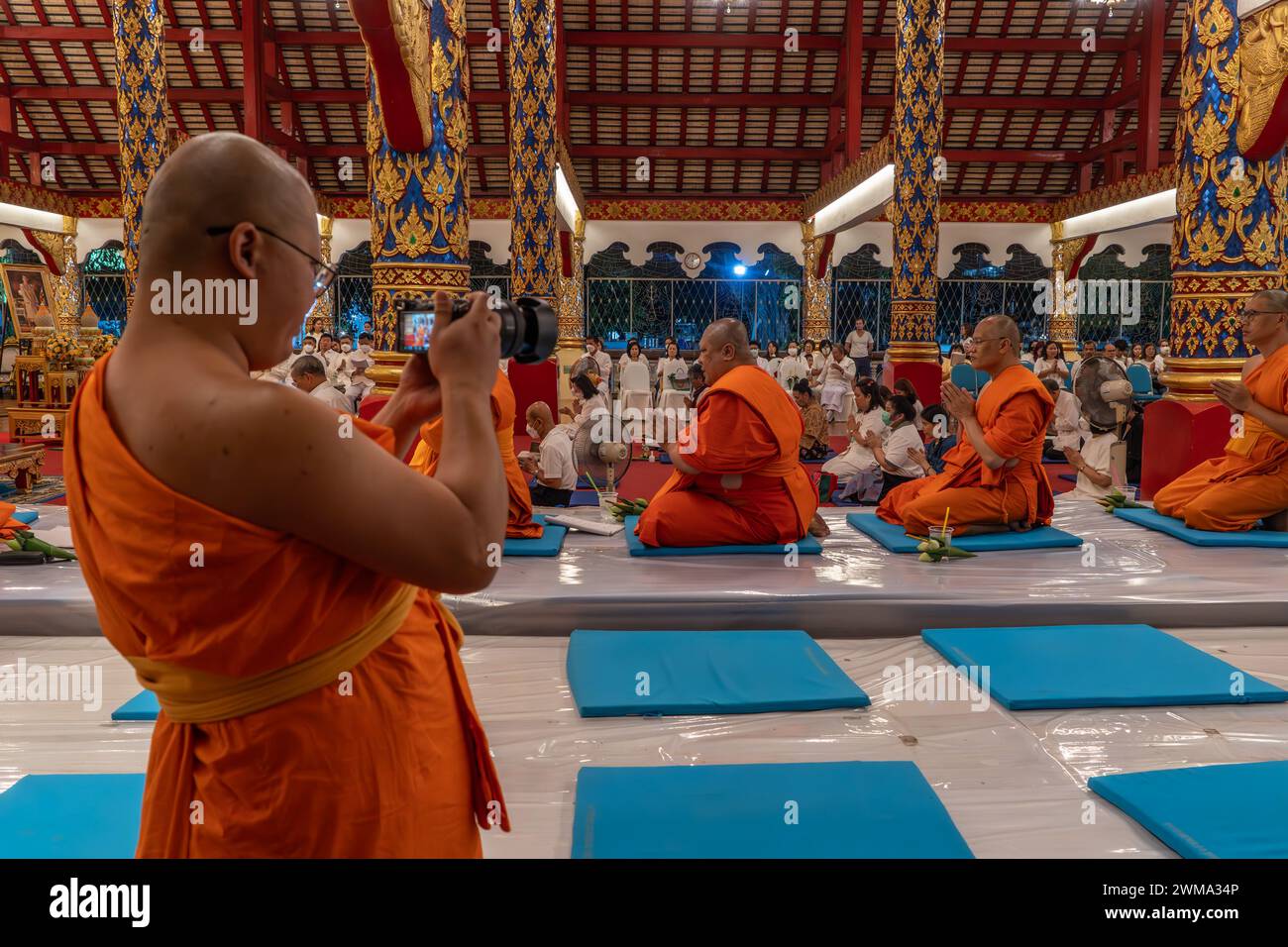 Local people and Buddhist monks celebrating the Magha Puja full moon festival at the Wat Suan ...