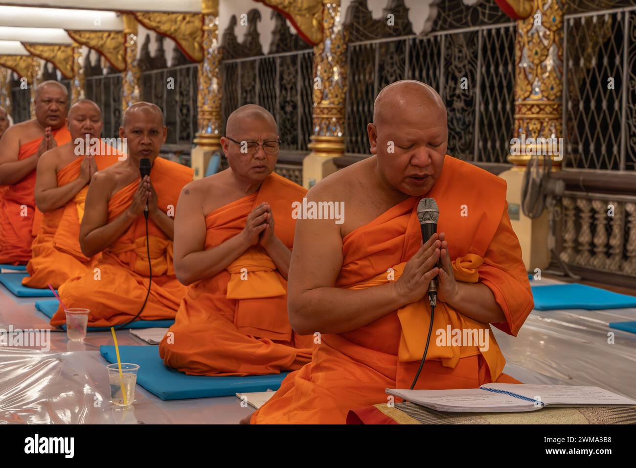 Local people and Buddhist monks celebrating the Magha Puja full moon ...