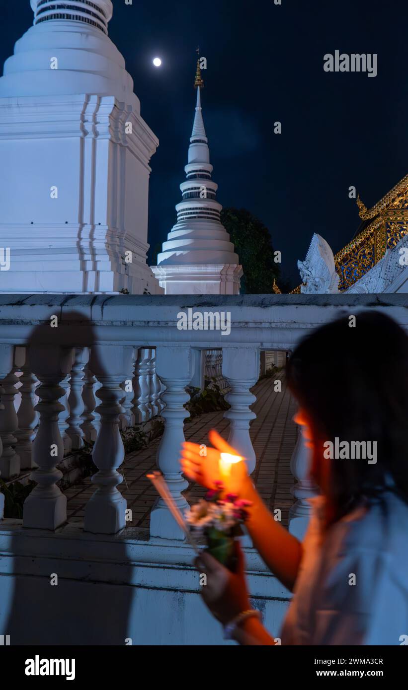 Local people and Buddhist monks celebrating the Magha Puja full moon festival at the Wat Suan ...