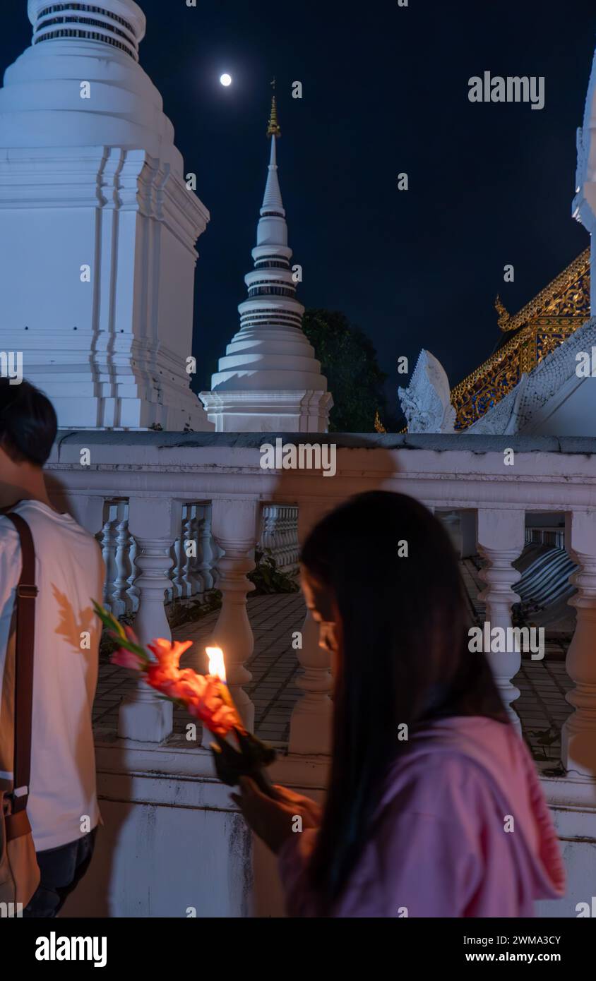 Local people and Buddhist monks celebrating the Magha Puja full moon festival at the Wat Suan ...