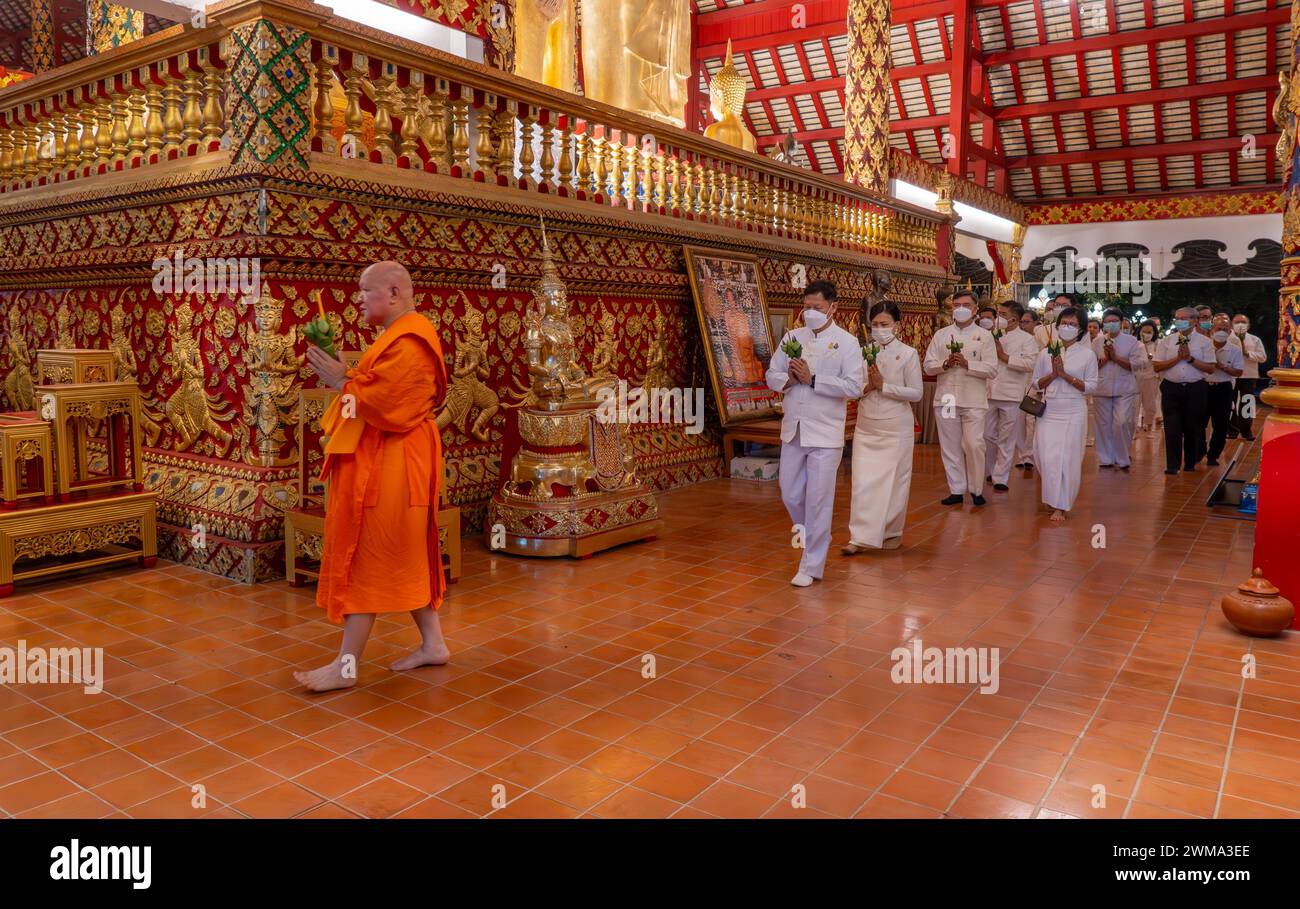 Local people and Buddhist monks celebrating the Magha Puja full moon ...