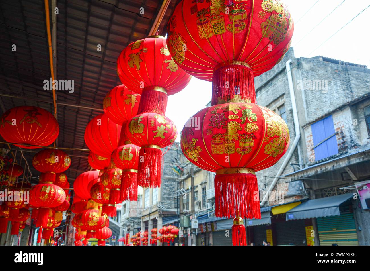 The traditional Chinese red lanterns hanging in front of people’s house ...