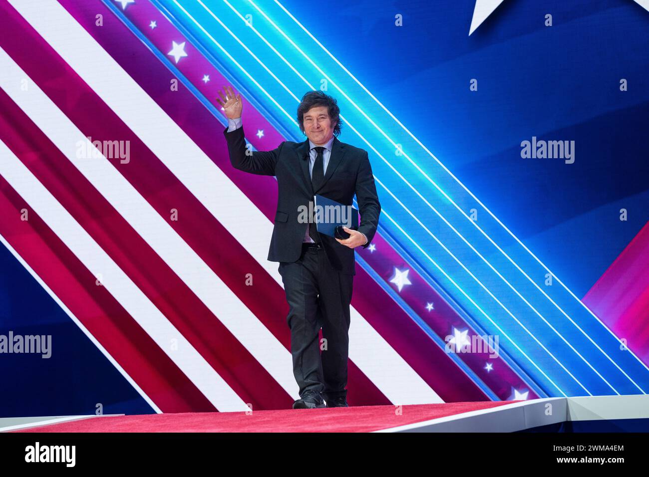 President of Argentina Javier Milei arrives on stage to speak during ...