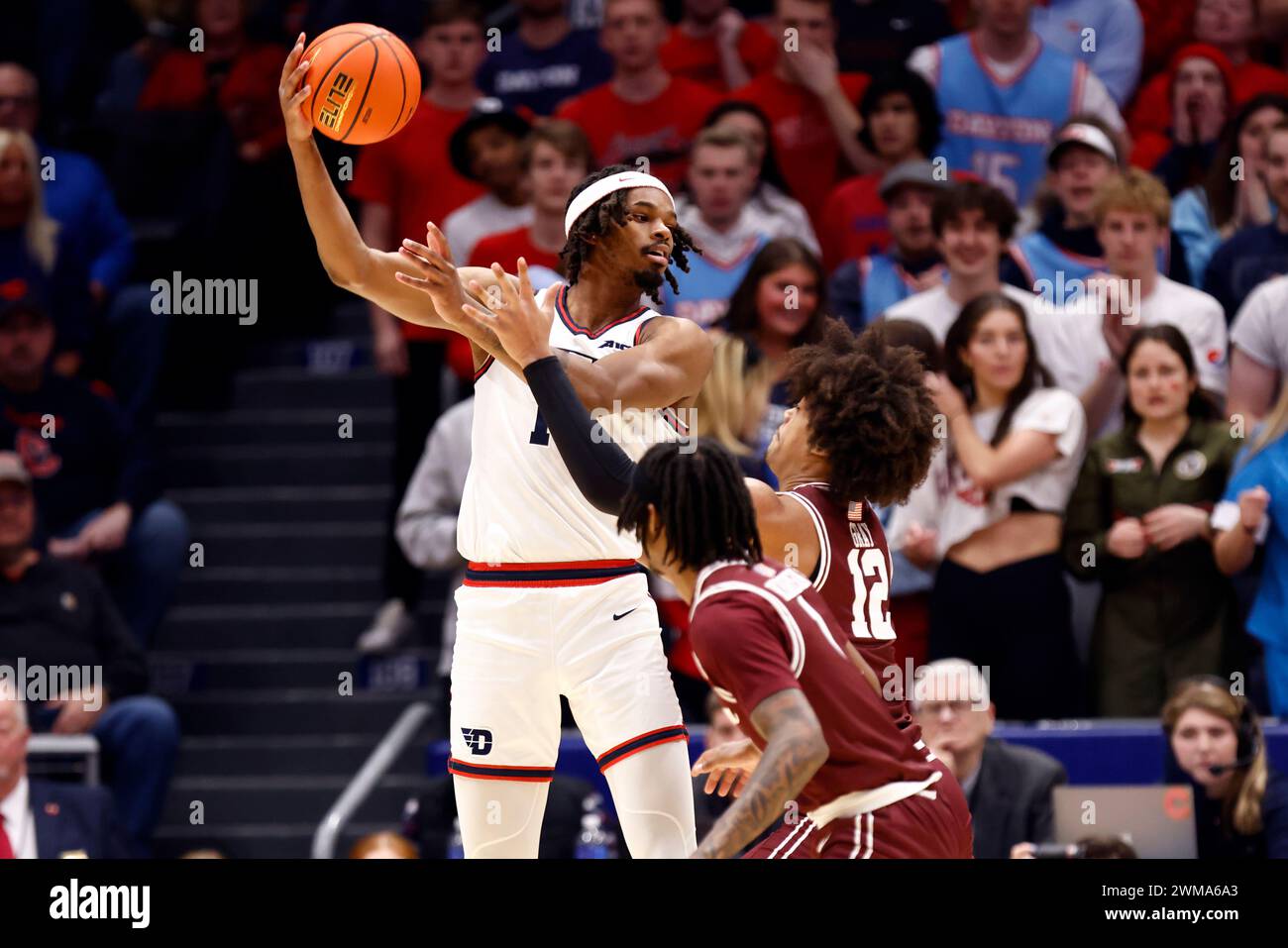 Dayton forward DaRon Holmes, left, passed in front of Fordham forward ...
