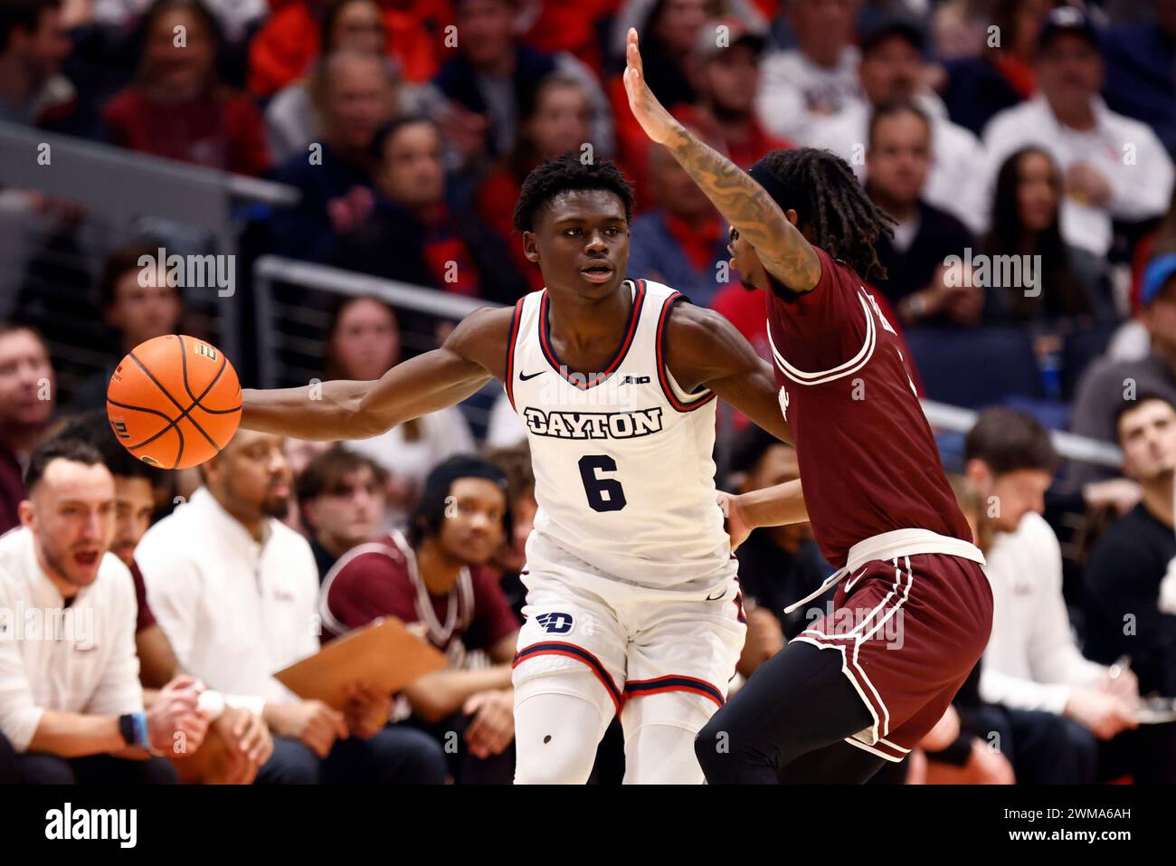 Dayton guard Enoch Cheeks, left, drives in front of Fordham guard Will ...