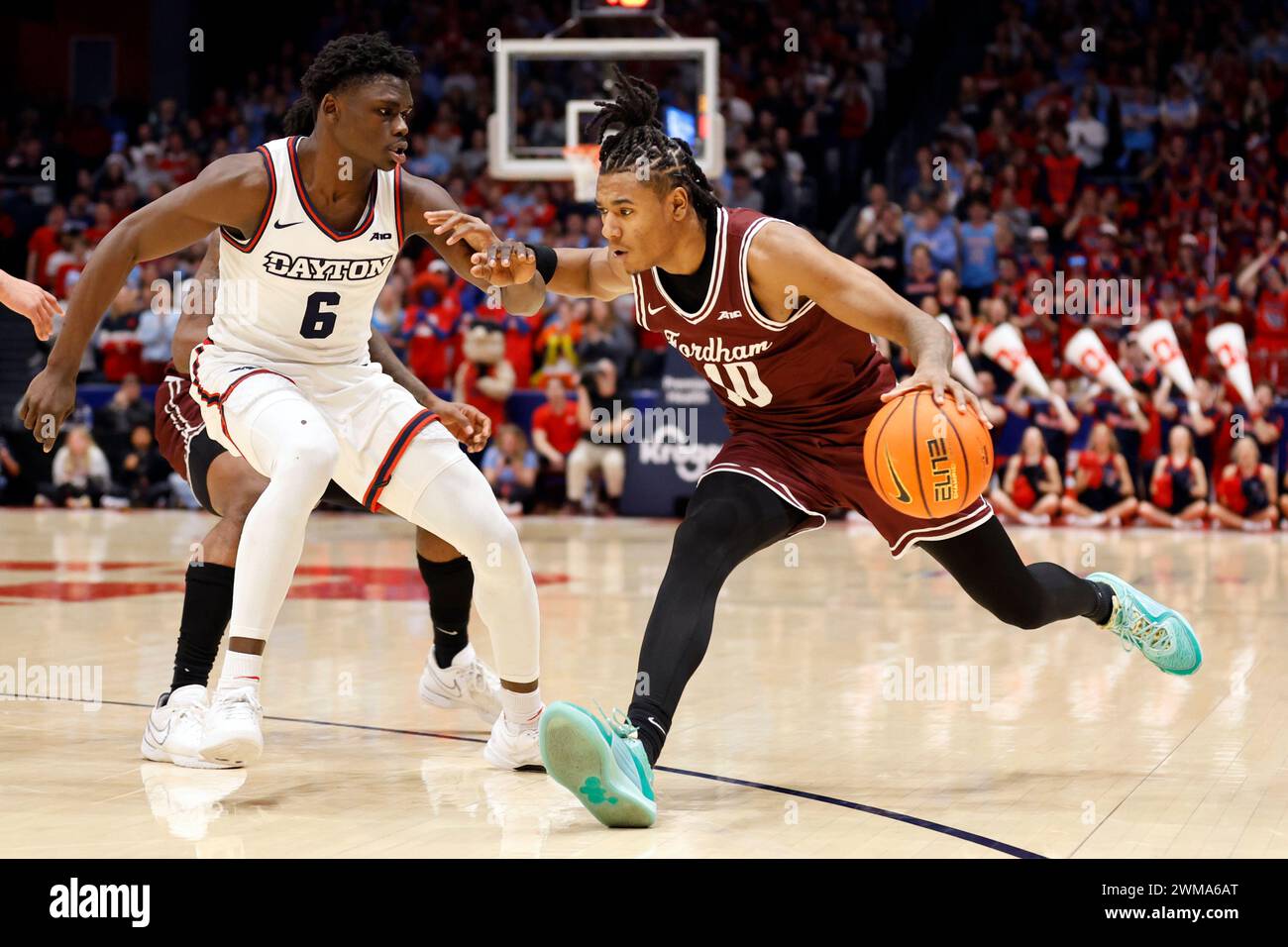 Fordham guard Kyle Rose, right, drives in front of Dayton guard Enoch ...