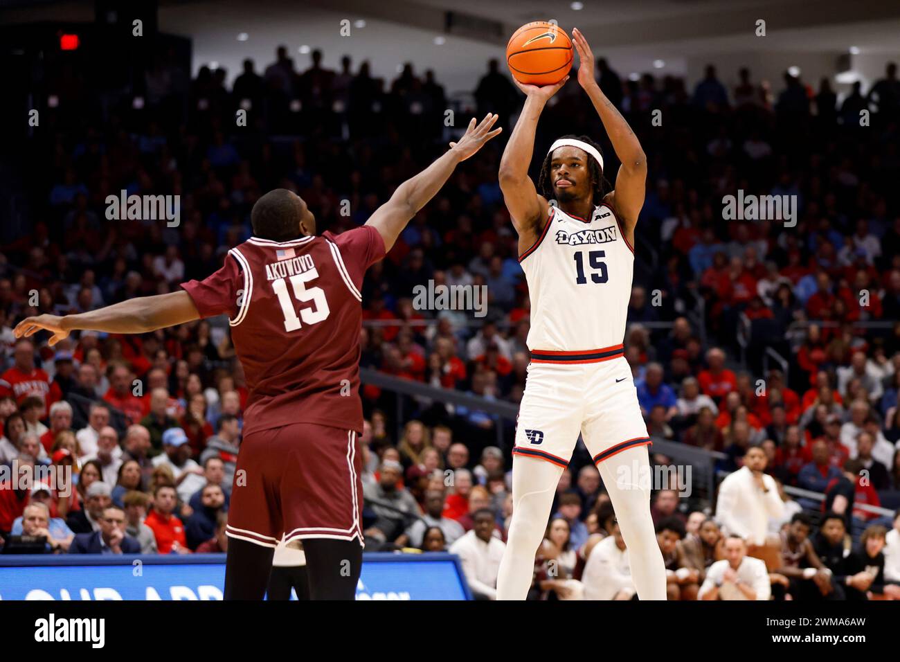 Dayton forward DaRon Holmes, right, shoots in front of Fordham forward ...