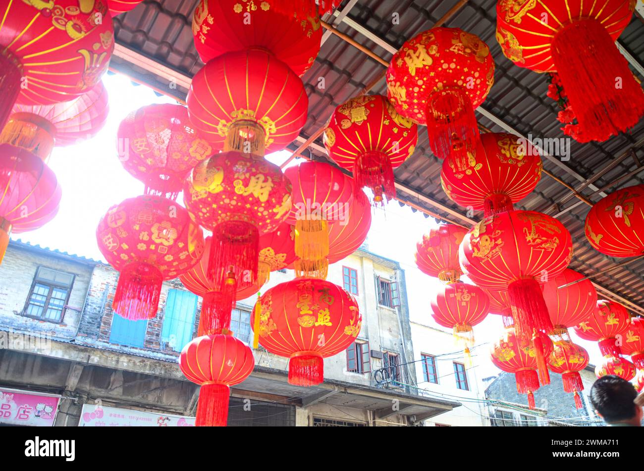 The traditional Chinese red lanterns hanging in front of people’s house ...