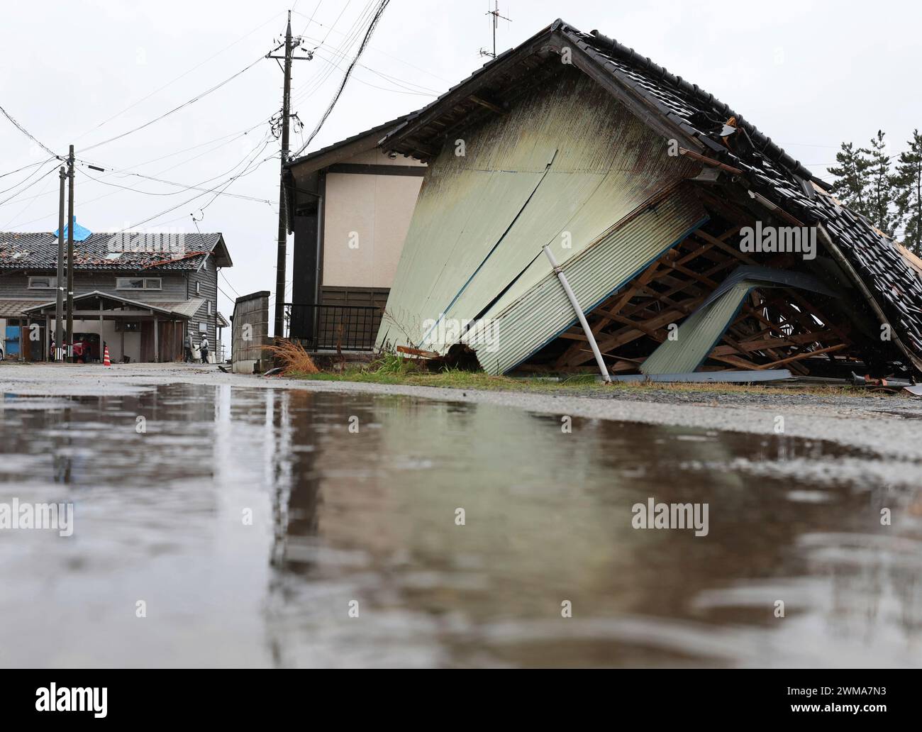 A photo shows a disaster-stricken area damaged by a massive earthquake ...