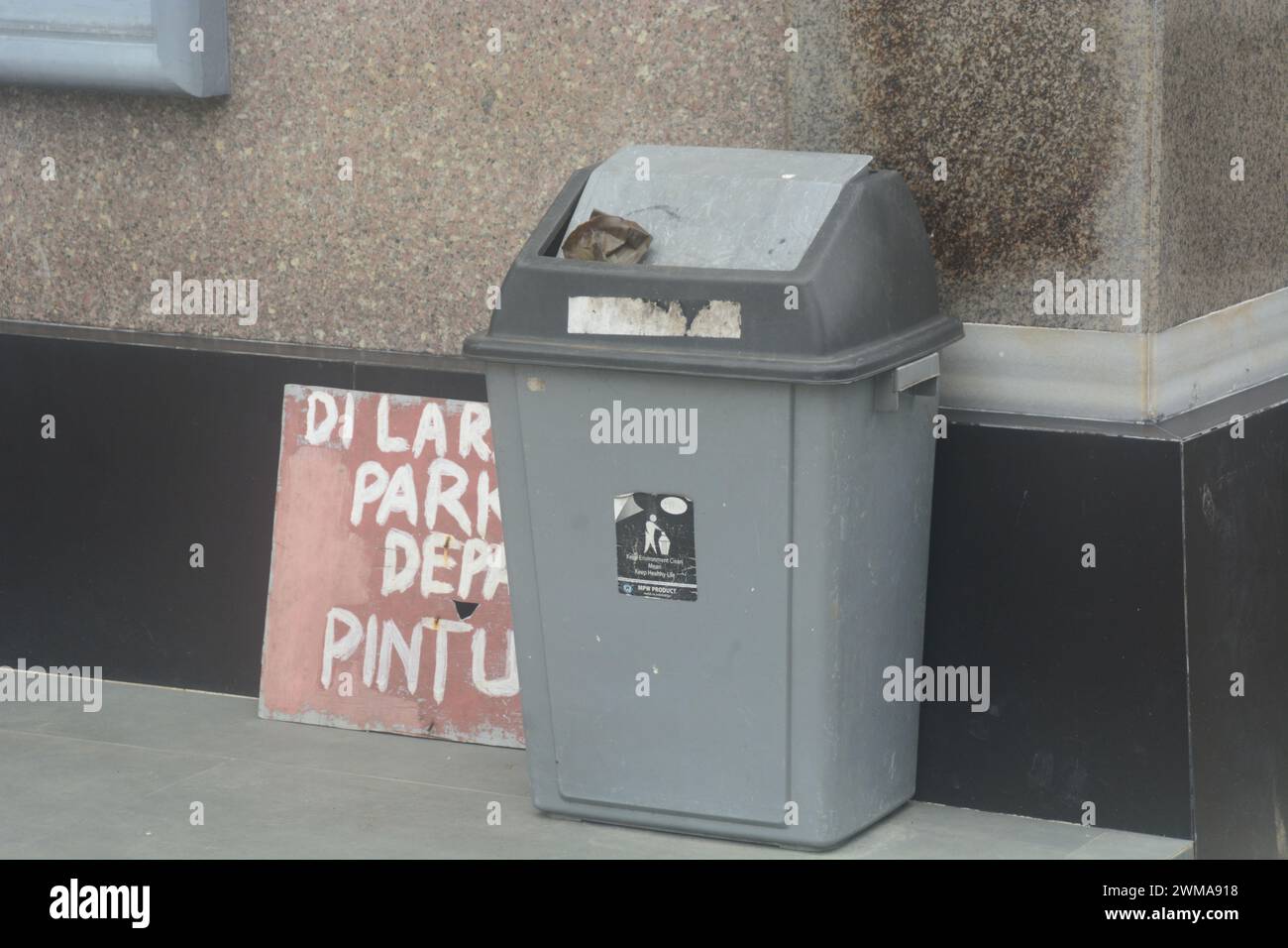 Gray bins are placed on the ground to create a clean environment ...