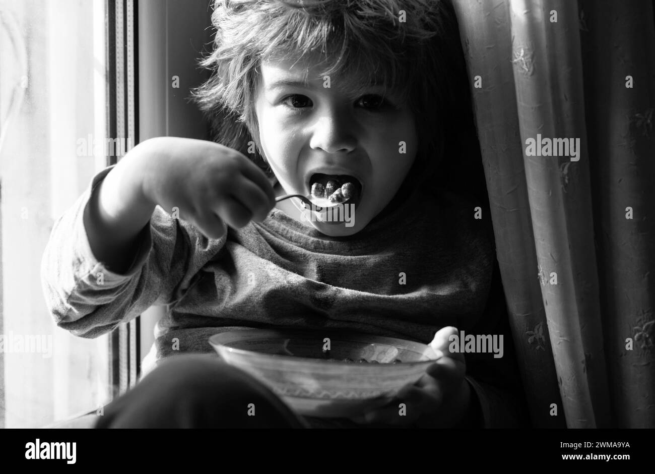 Hungry kid eat. Child eating healthy food. Cute little boy having soup ...