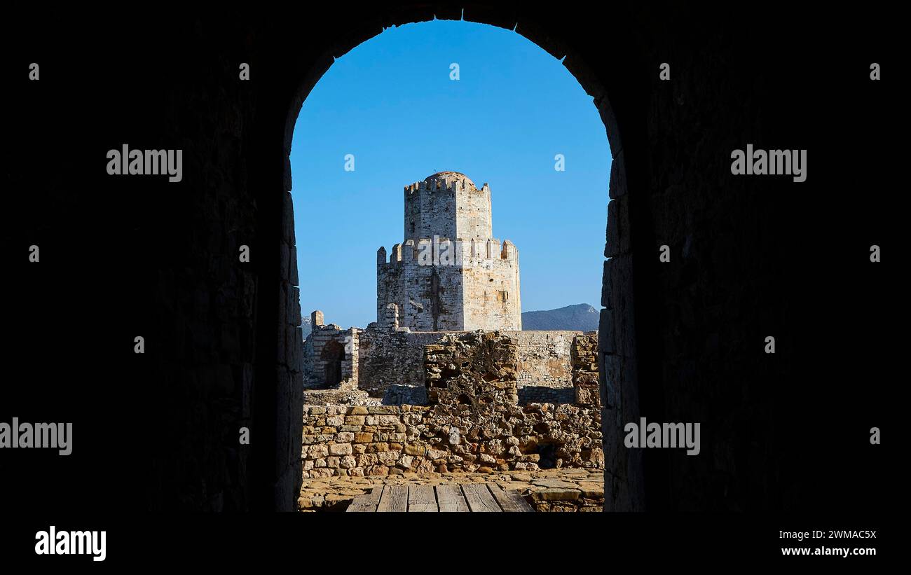 View through a stone arch to a ruin and the sea beyond, octagonal ...
